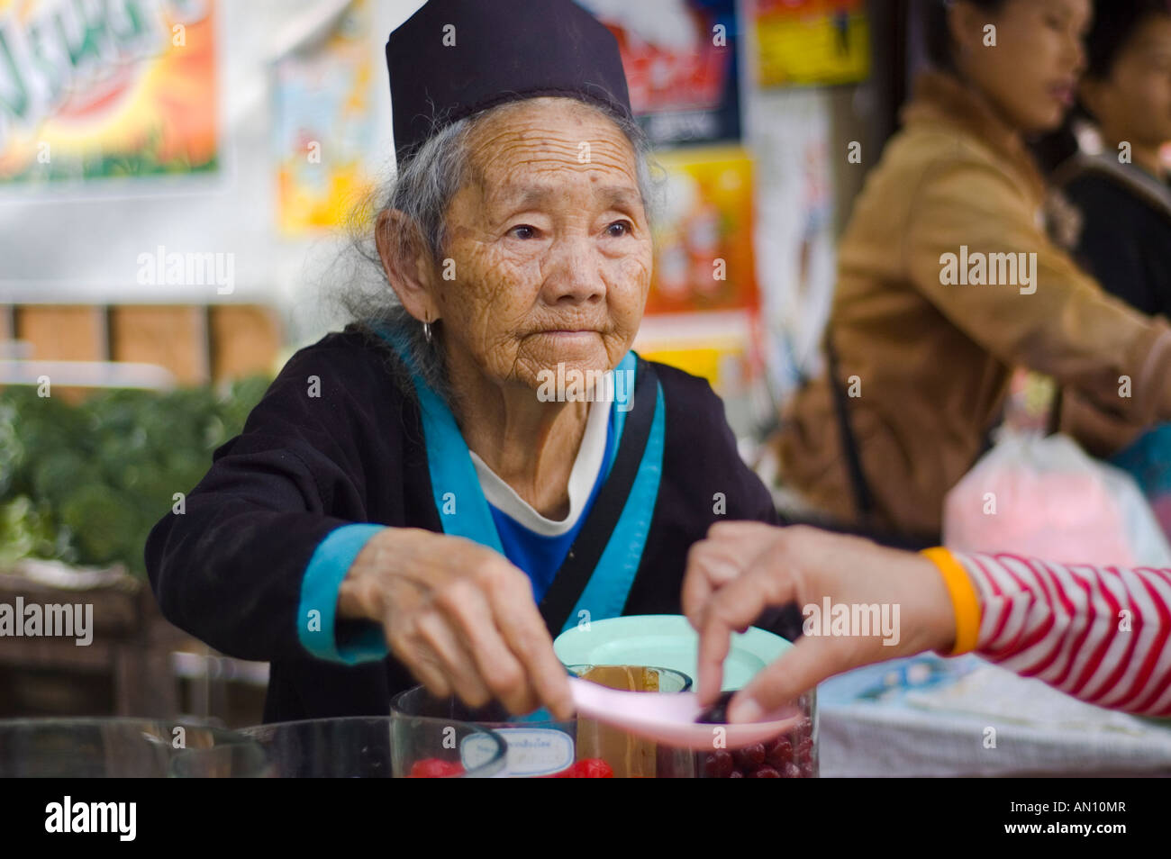 Old woman selling in the market Stock Photo - Alamy