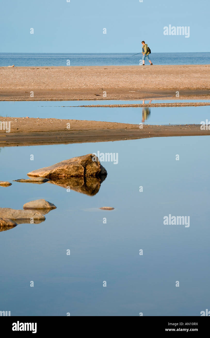 Lake with rocks and sandbar Stock Photo - Alamy