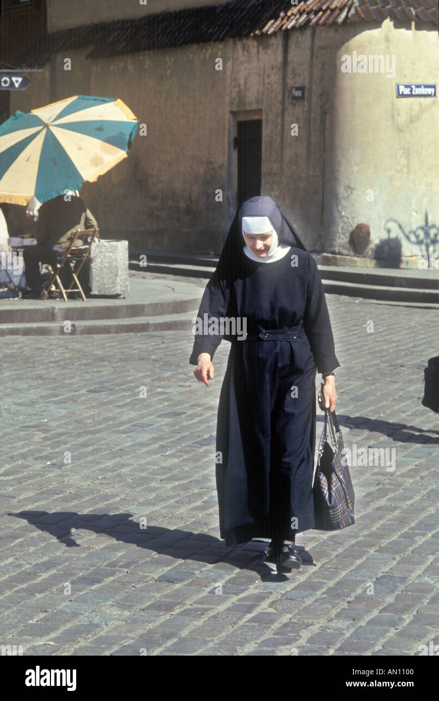 A nun crossing Castle Square in Warsaw Stock Photo - Alamy