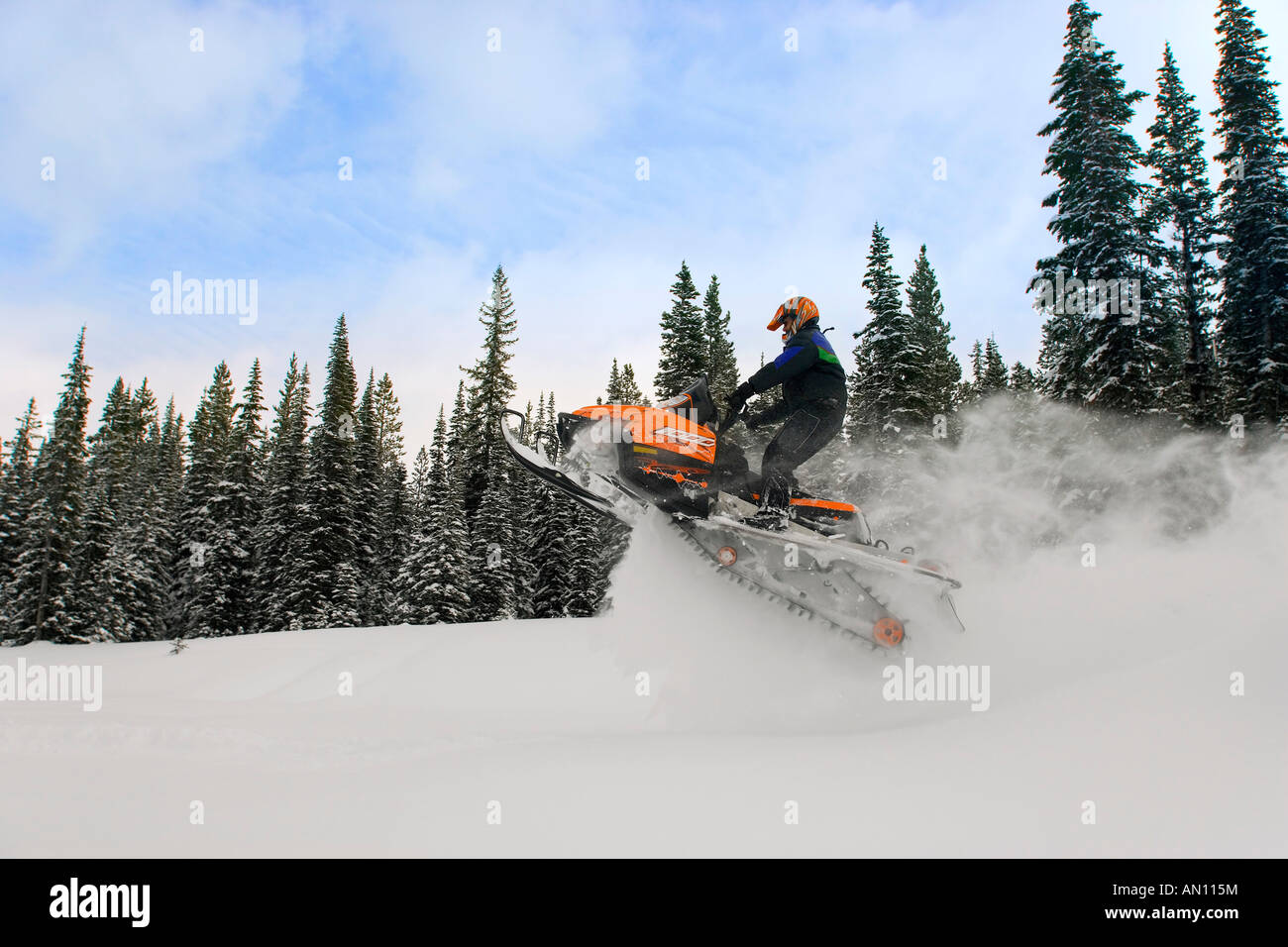 Flying through the air on a snowmobile Stock Photo - Alamy