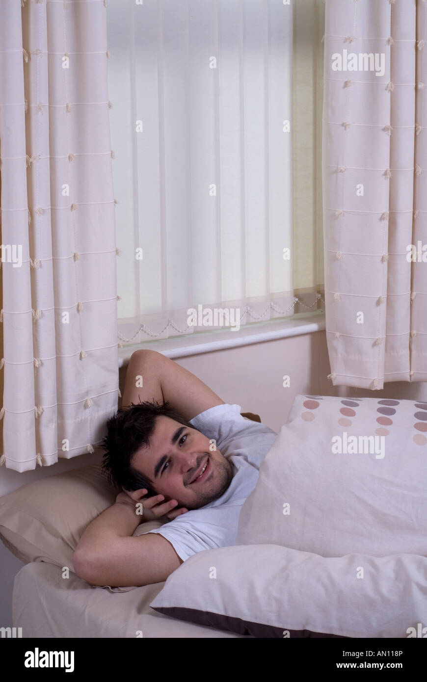 Man in bed Stock Photo - Alamy