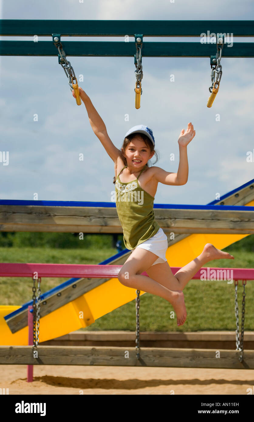 Girl on playground monkey bars hi-res stock photography and images - Alamy