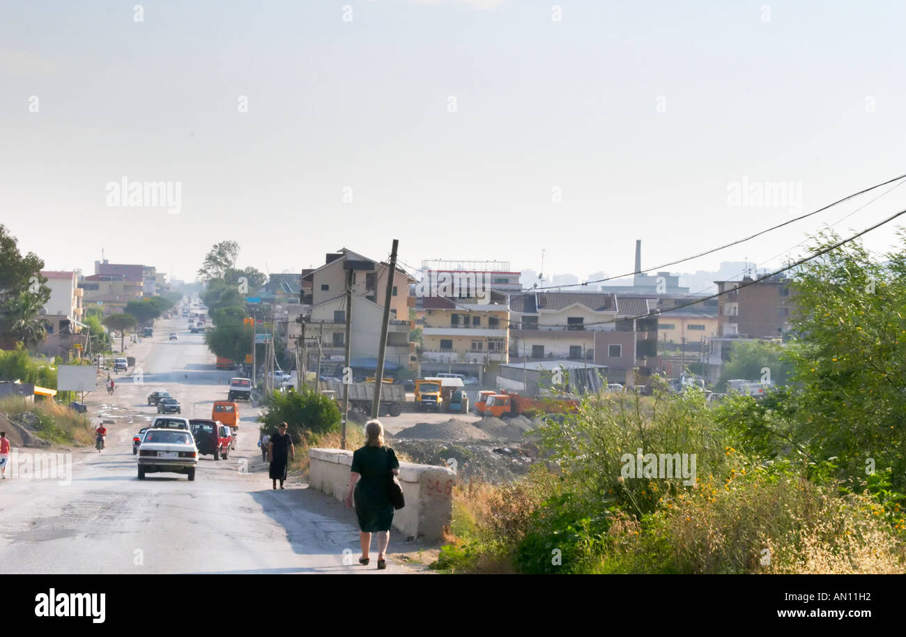 View over a street with cars and pedestrians in Durres in hot hazy ...