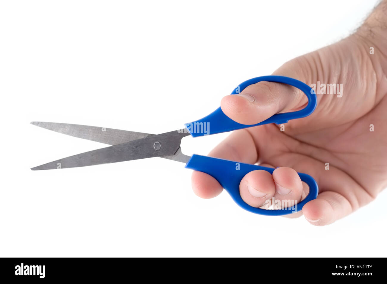 A hand holding scissors Stock Photo - Alamy