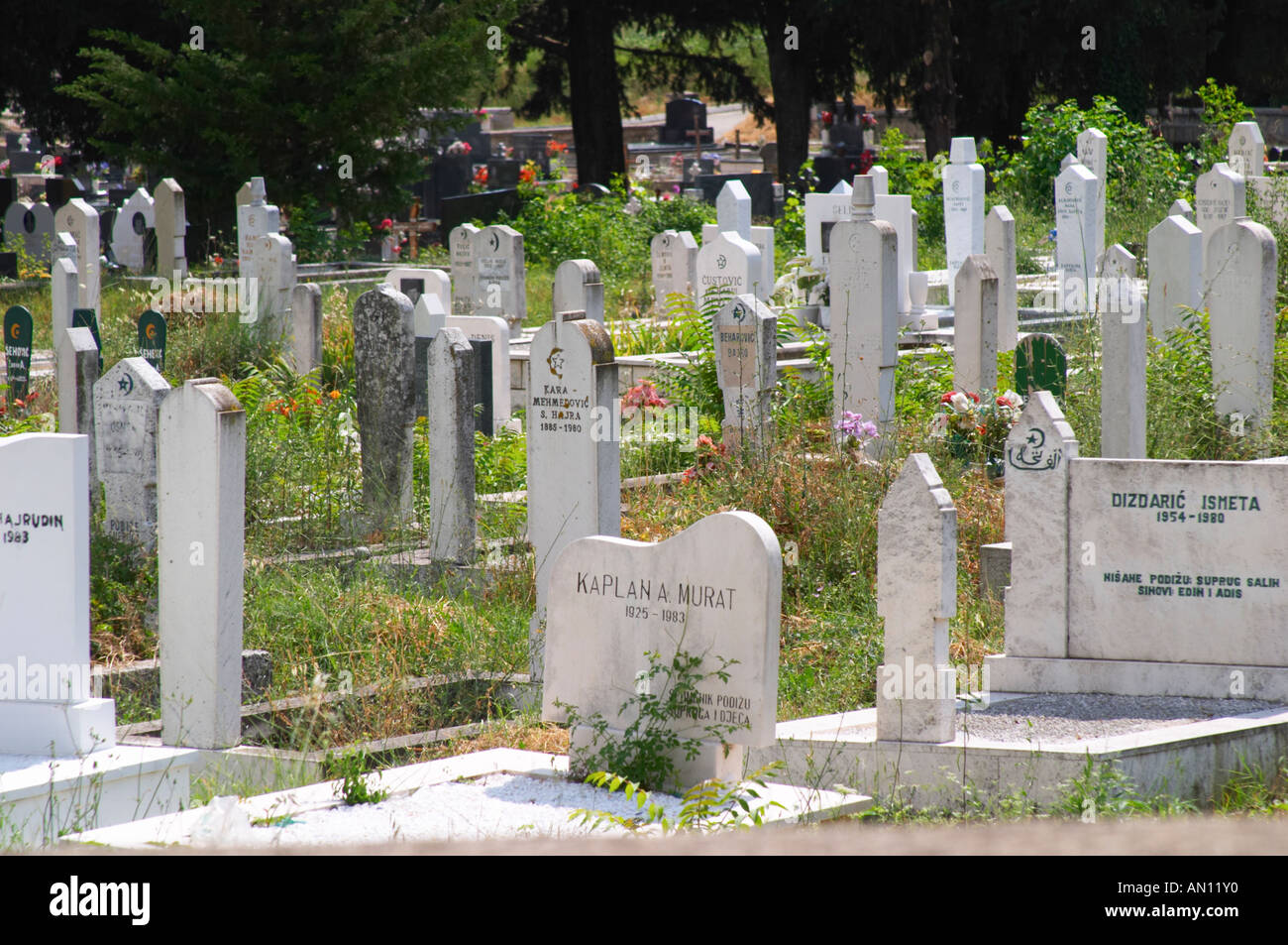 A grave yard church yard burial place with many recent graves with ...