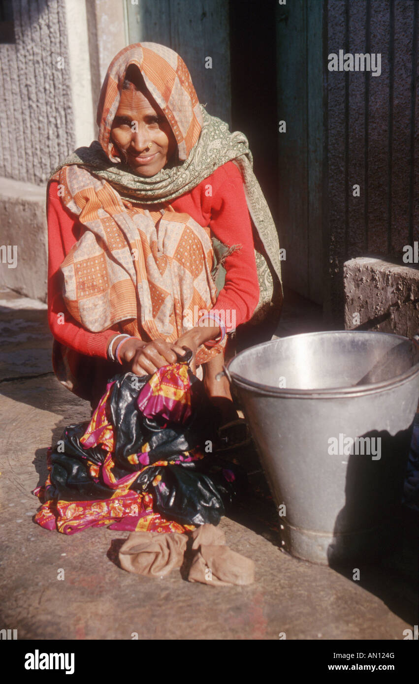 Woman crouching in street hi-res stock photography and images - Alamy