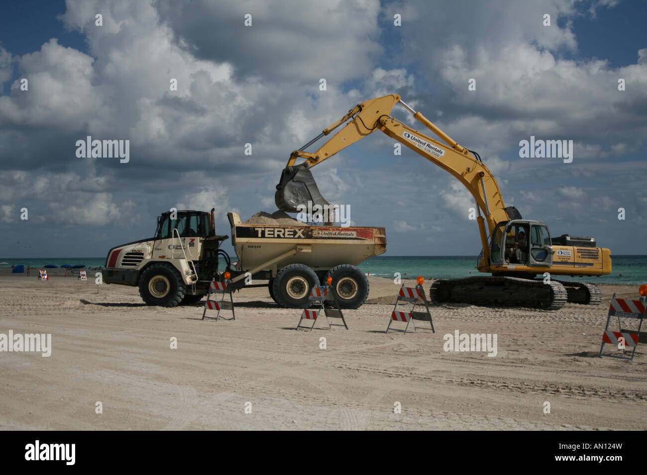 excavator loading sand onto truck on Miami beach November 2007 Stock ...