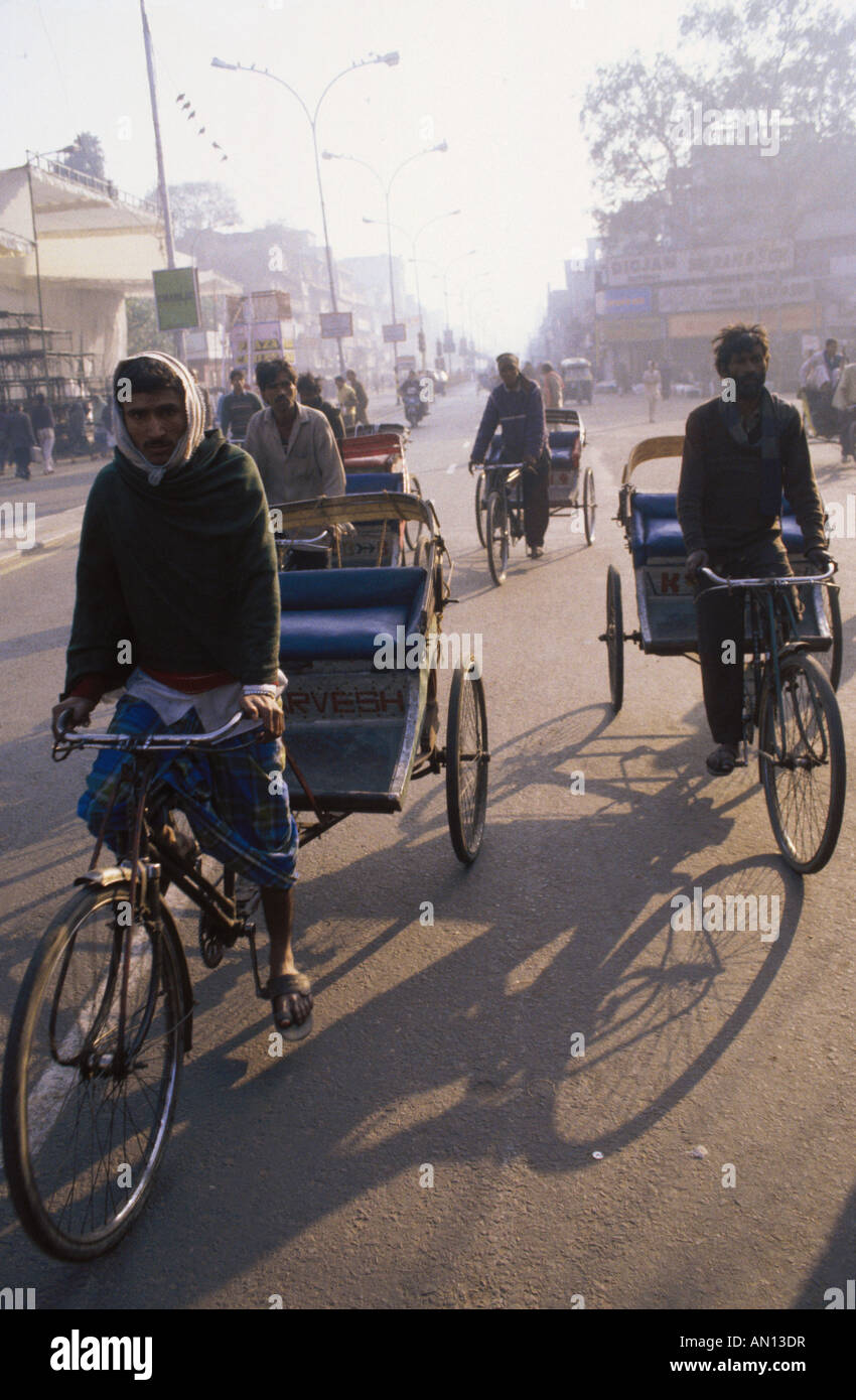 Men riding cycle rickshaws waiting for custom in Indian street Stock ...