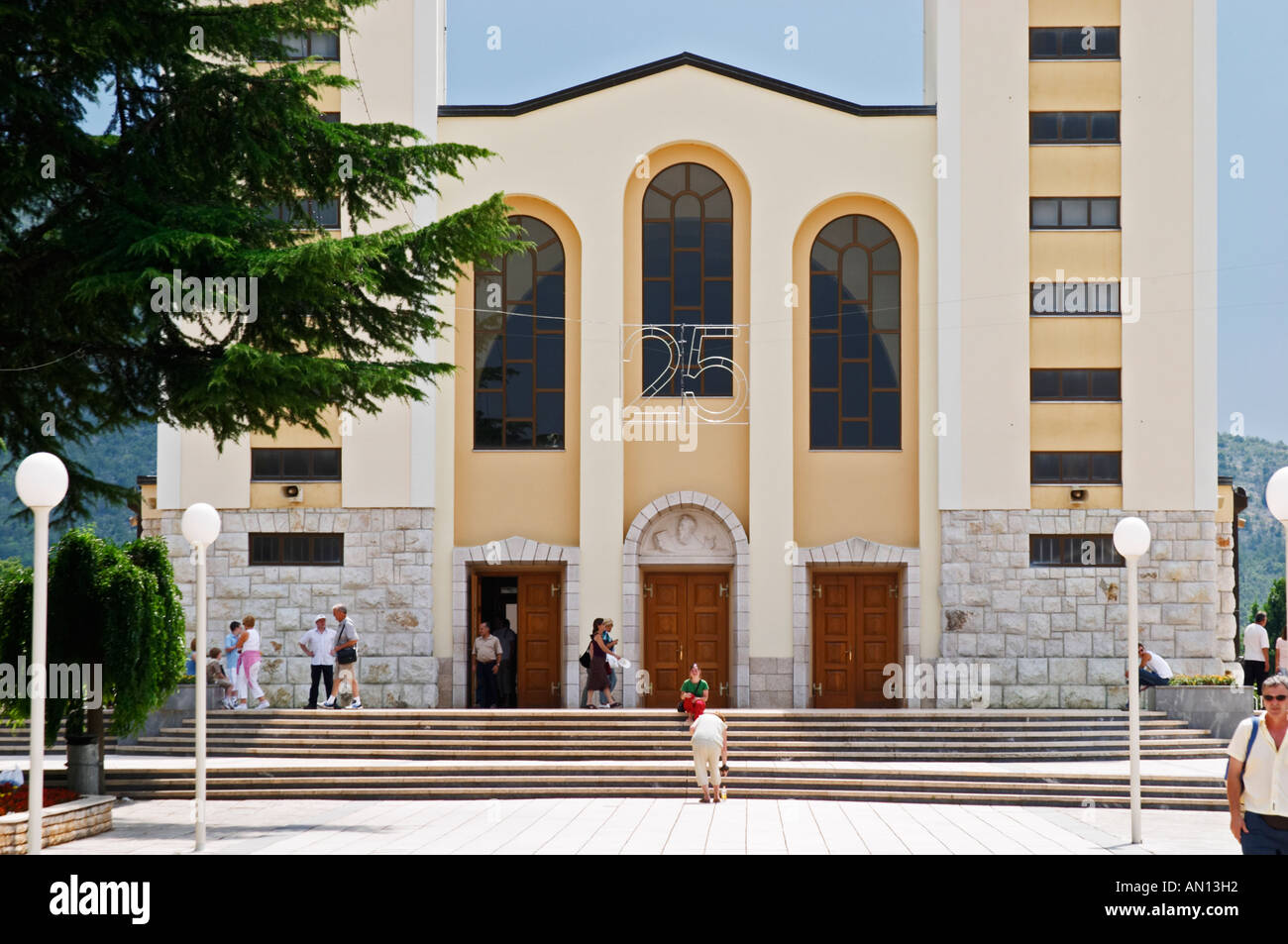 The facade of The church with its twin church towers. Medugorje ...