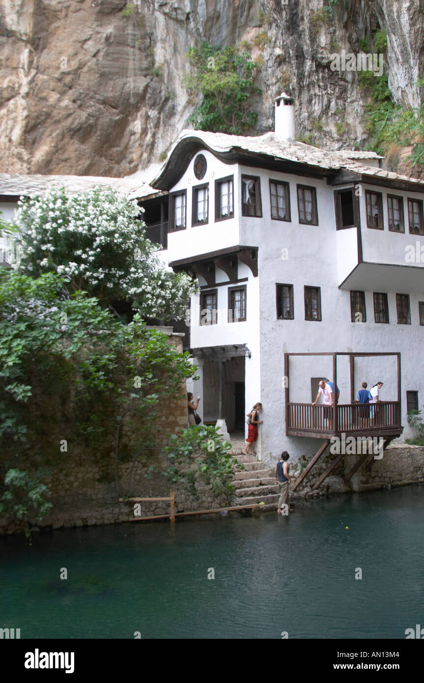 The house with stairs down to the river. The source of the Buna river ...