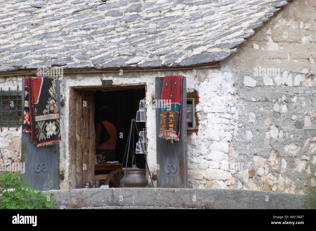 The old Ottoman style water mill building with roof tiled with stone ...