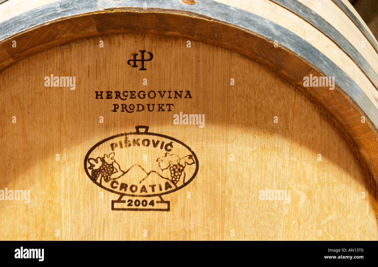 Oak barrel with stamp saying the winery's name and that the barrel is ...