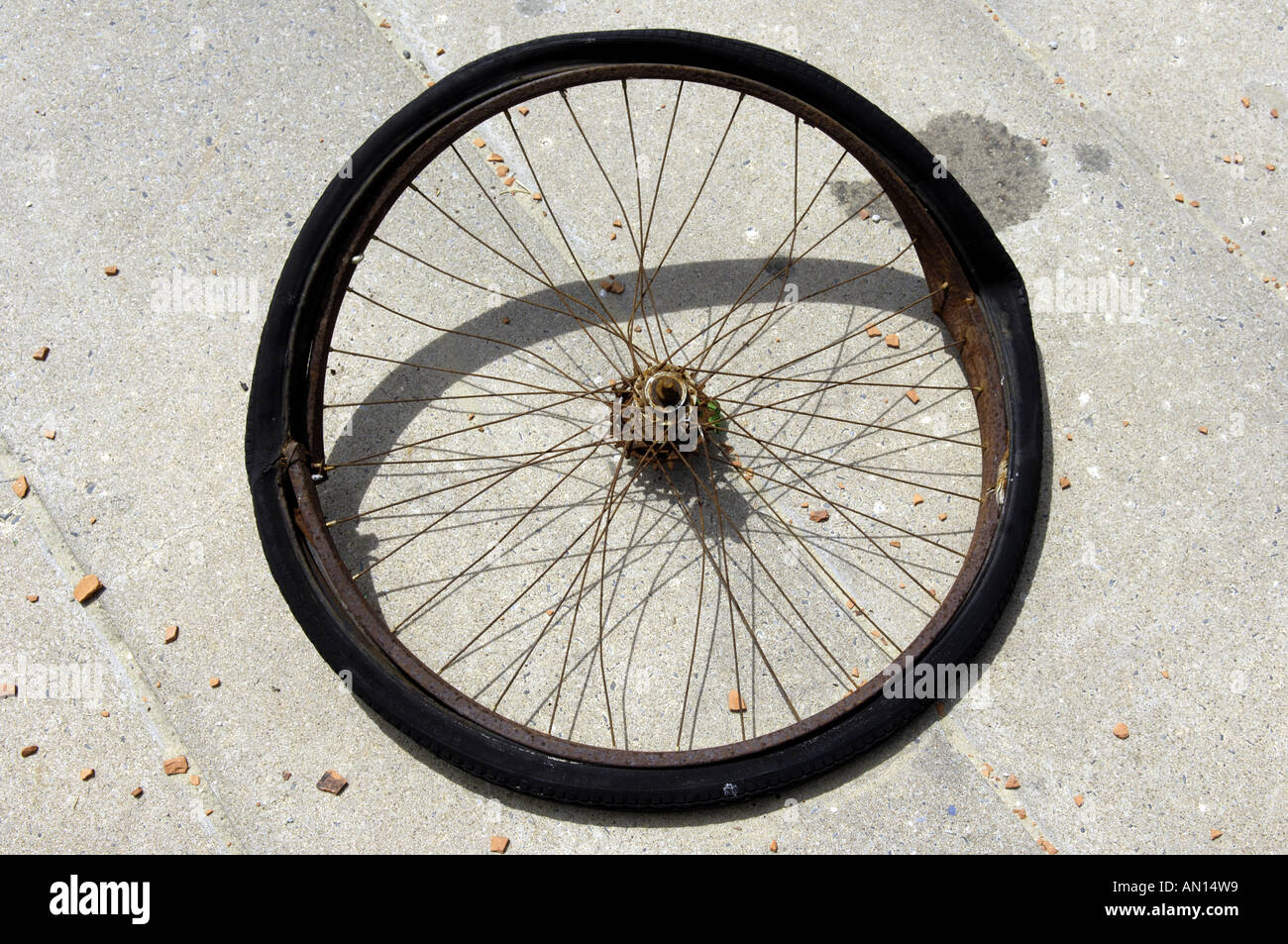 cycle wheel tyre one sand beach rubbish pollution litter left abandoned ...
