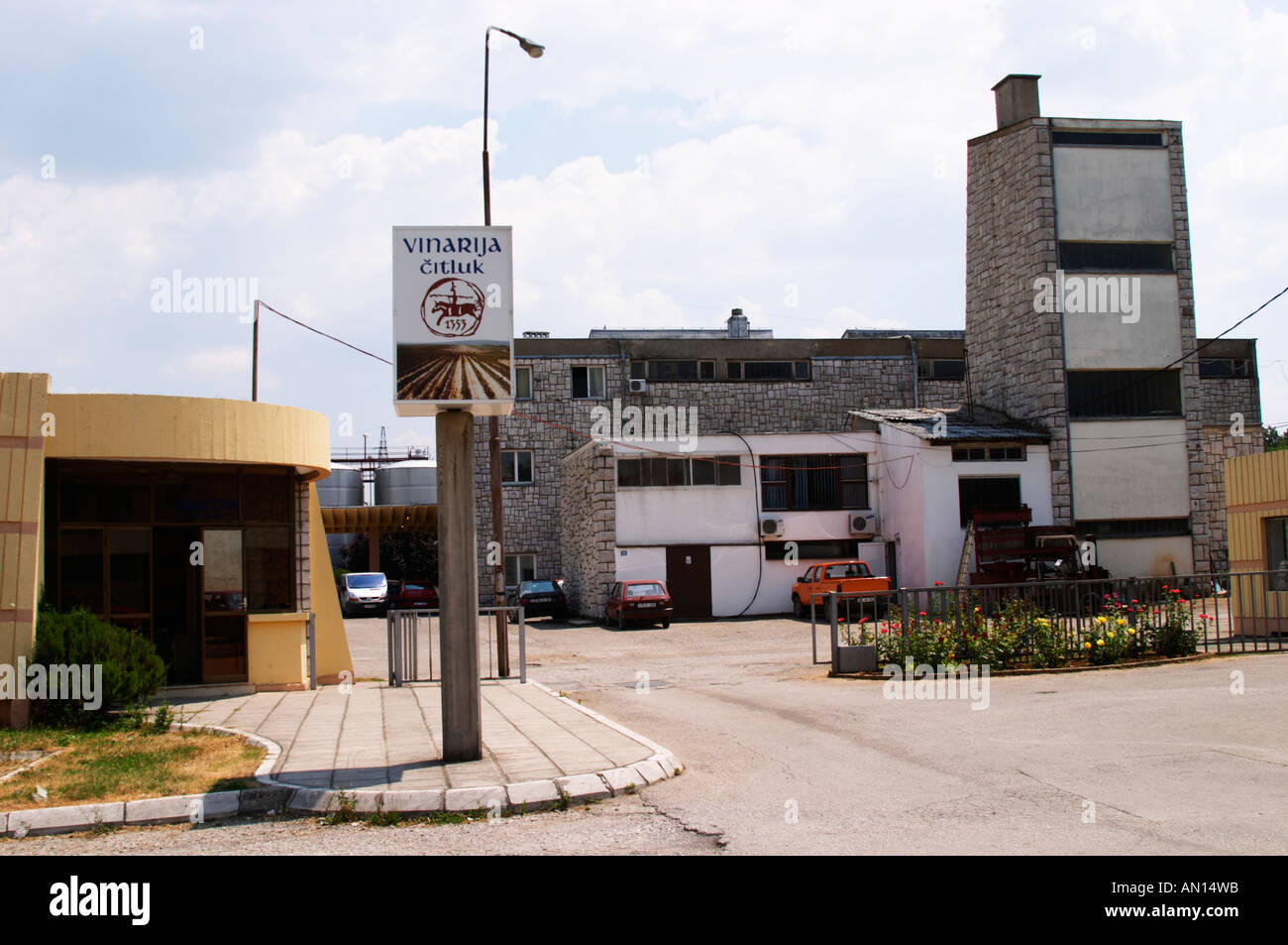 The entrance to the winery, the gate, the main winery building and a ...