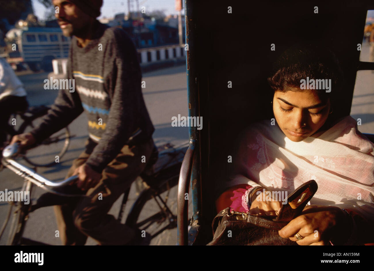 View inside an auto rickshaw with a woman looking into her bag while a ...