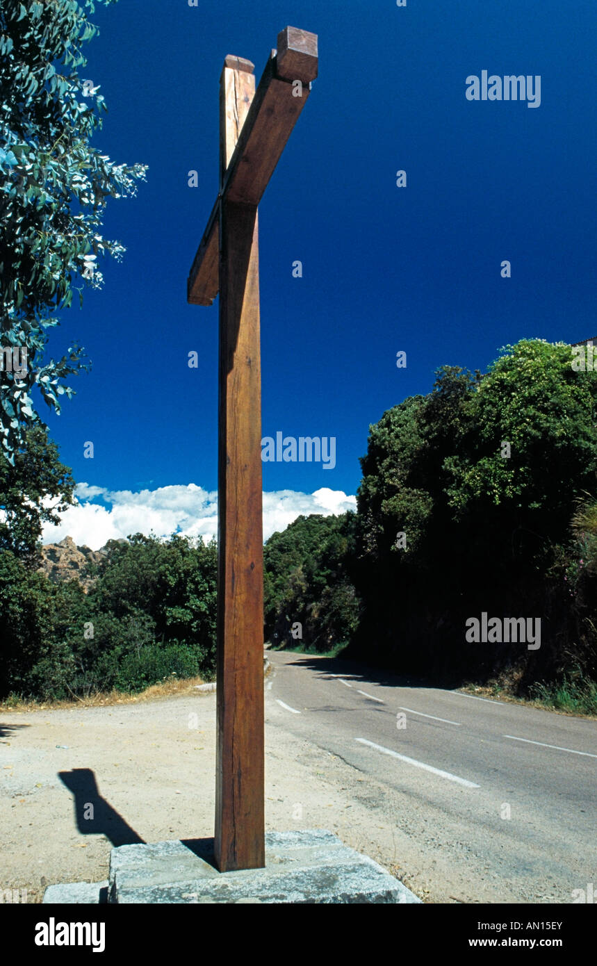 Wooden cross erected by the side of the road in Corsica, France Stock ...