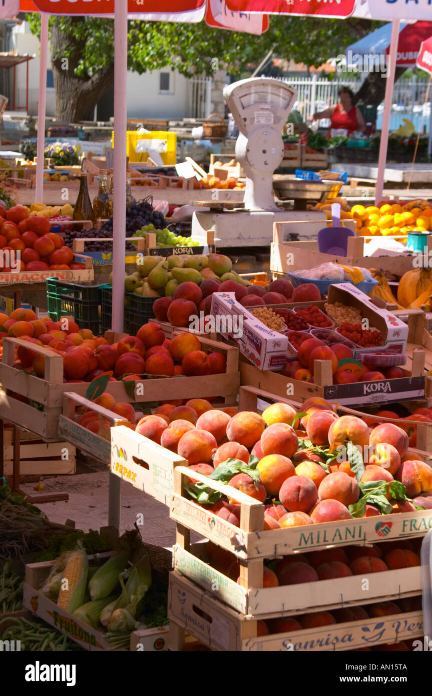 Peaches and other fruit. In the fruit and vegetable market in the ...
