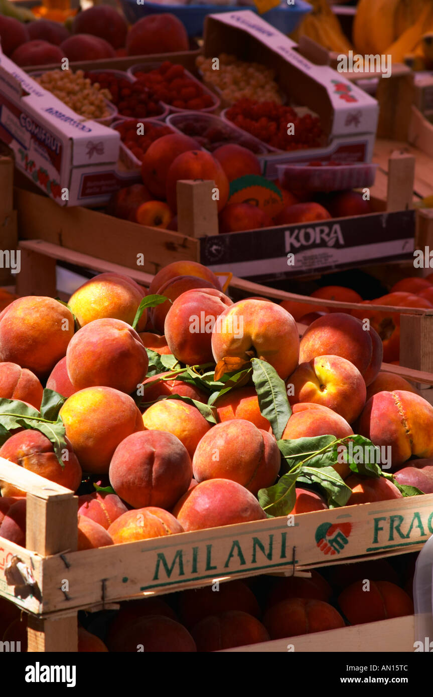 Peaches in a tray, pallet. In the fruit and vegetable market in the ...