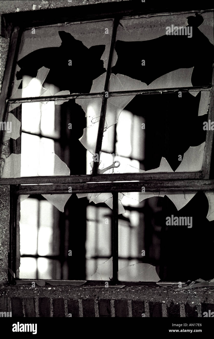 Broken window in abandoned building Stock Photo - Alamy