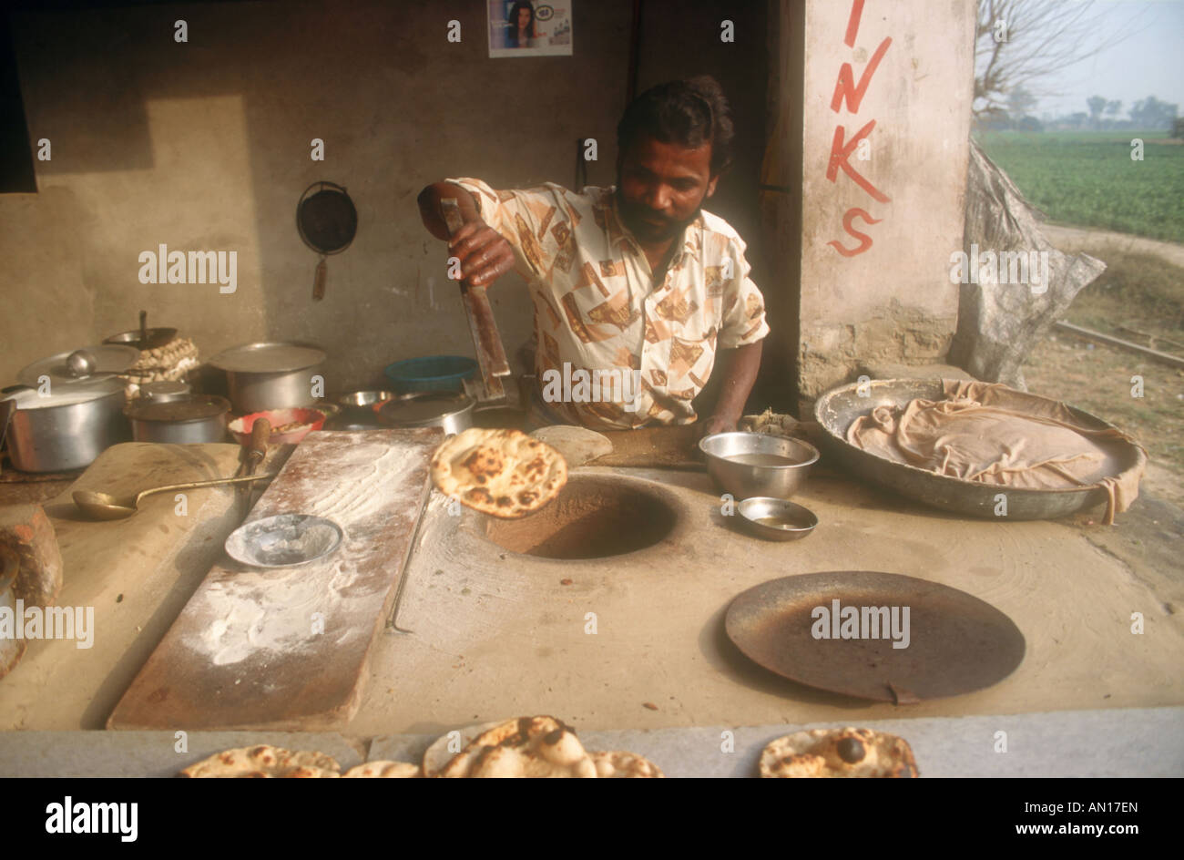 Man making nan bread in Tandoori oven. India Stock Photo - Alamy
