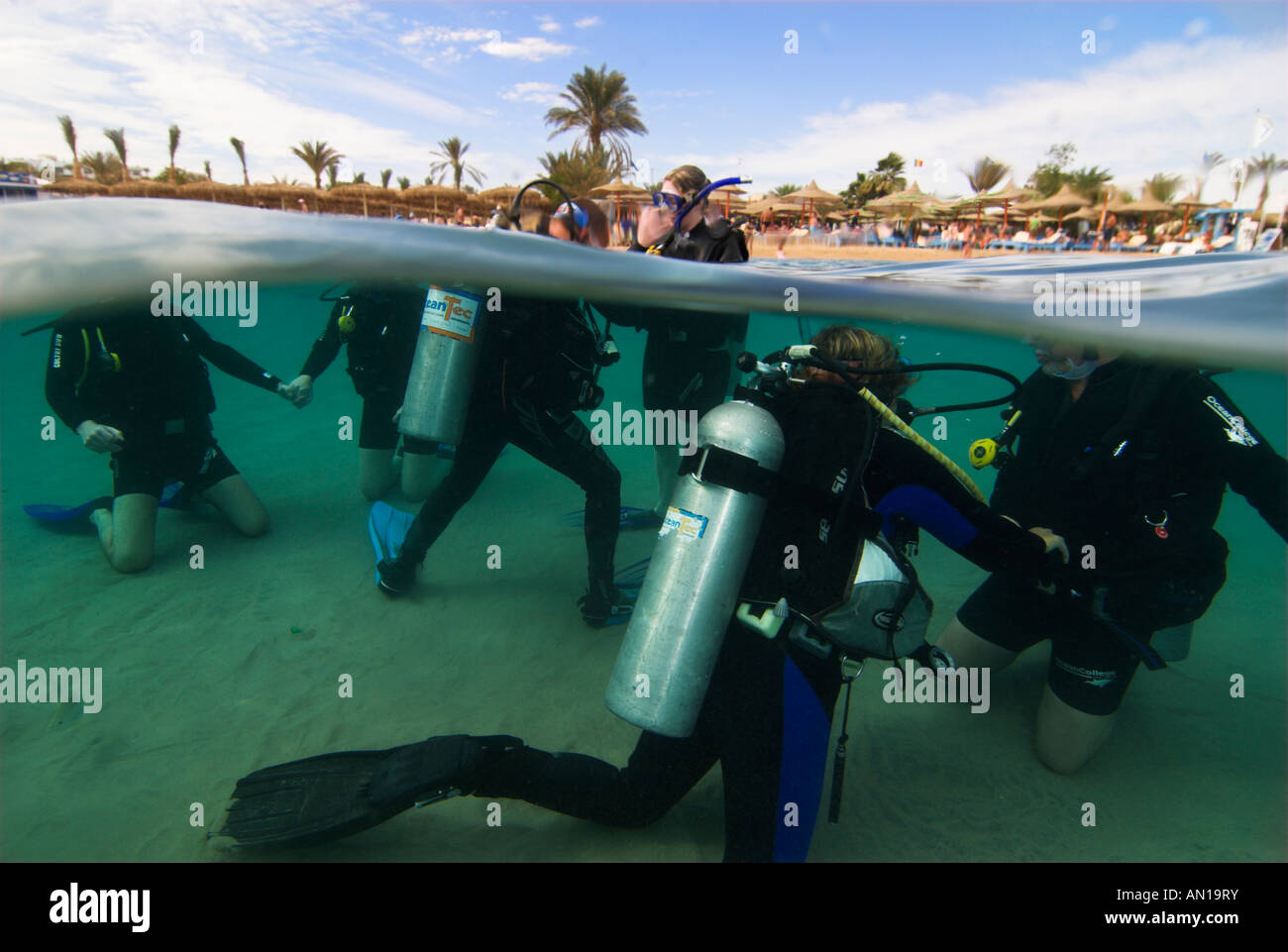 Learning to scuba dive off beach shallow water Sharm El Sheikh with ...