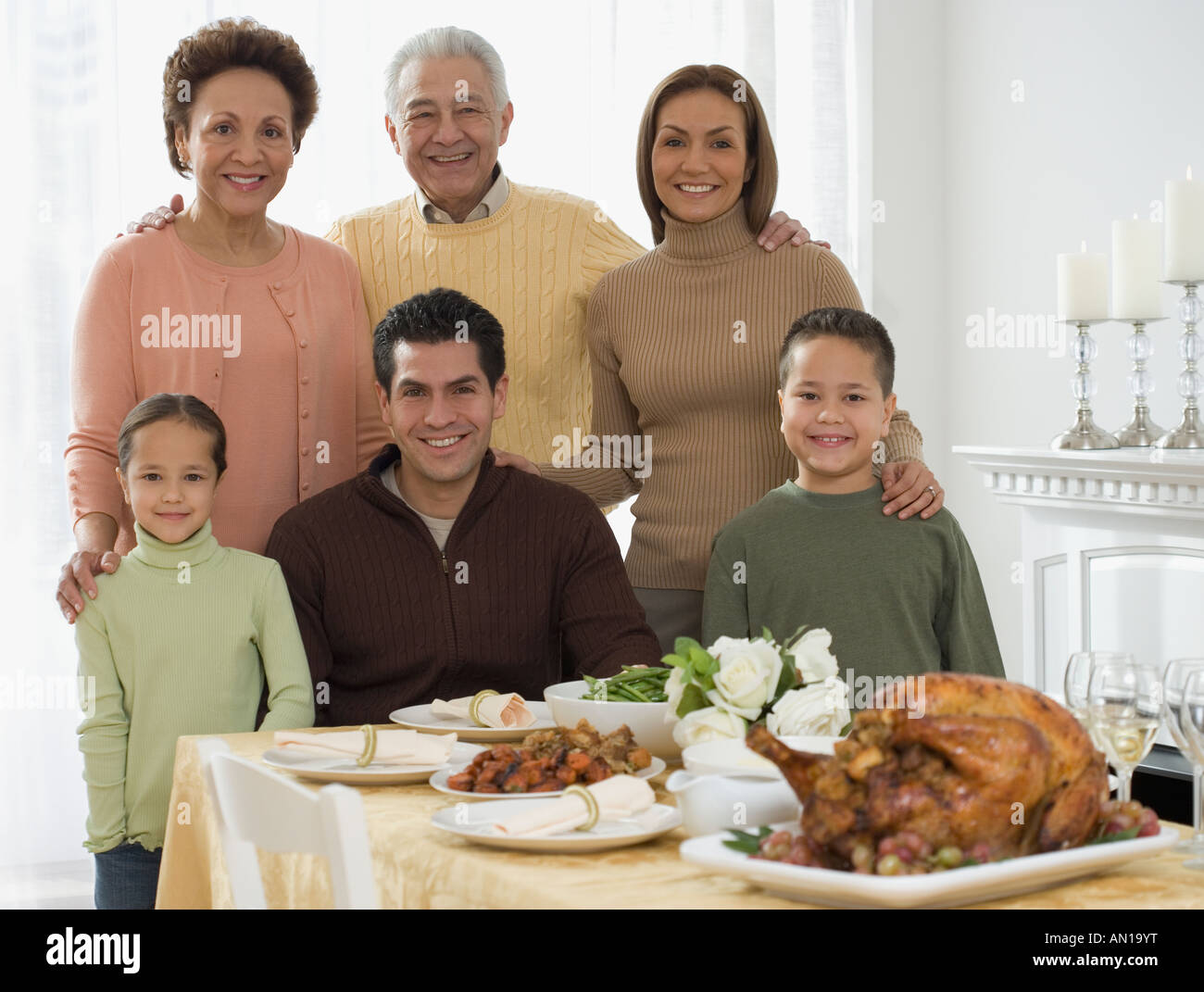 Multi-generational Hispanic family at Thanksgiving table Stock Photo ...