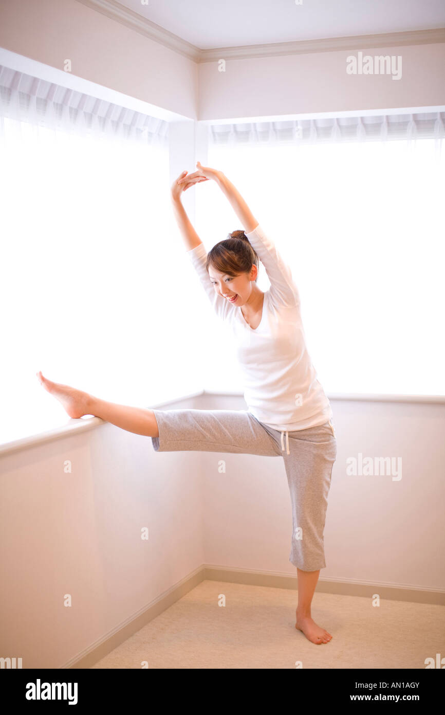 Japanese woman doing exercise Stock Photo - Alamy
