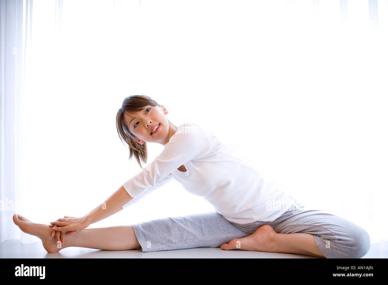 Japanese woman doing exercise Stock Photo - Alamy