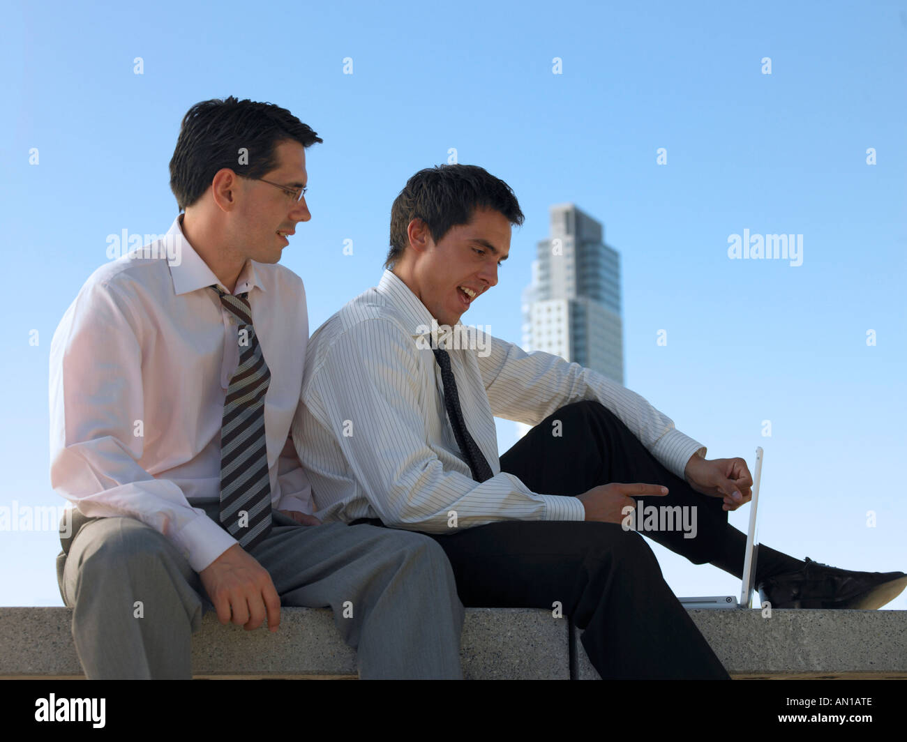 Two men sitting outside shoes hi-res stock photography and images - Alamy