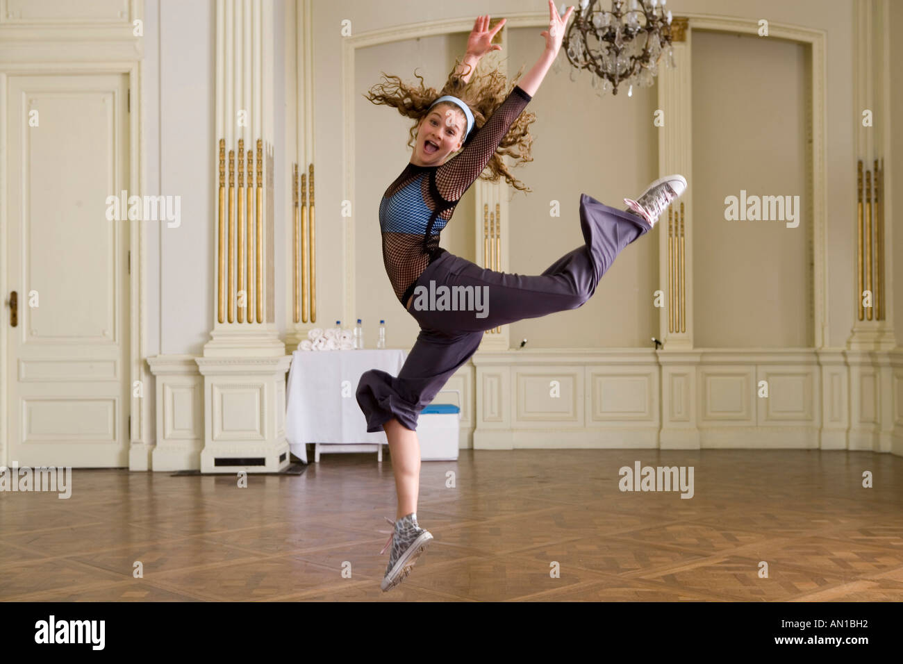 Beautiful young woman moving through hi-res stock photography and ...