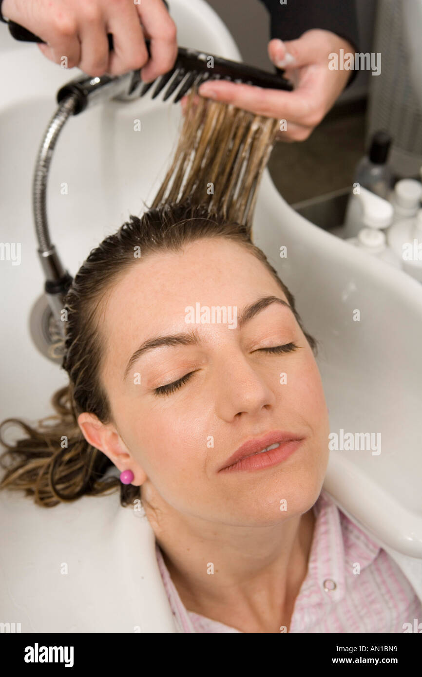 Woman having her hair combed hi-res stock photography and images - Alamy
