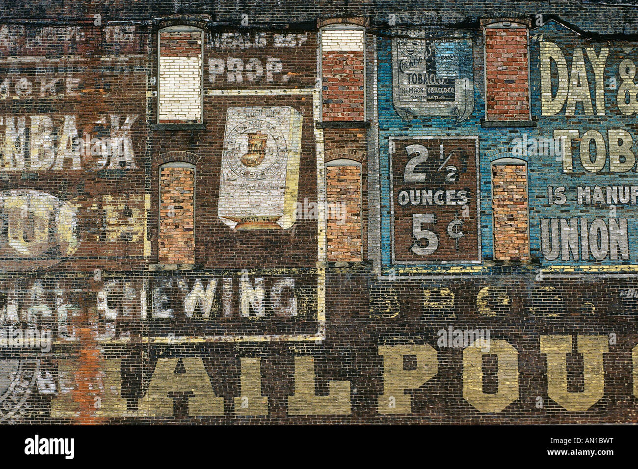Old advertisements on the side of a brick building in Canton Ohio USA ...