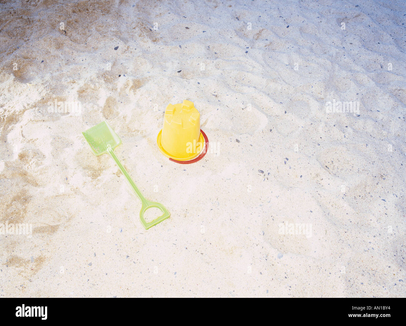 Bucket and spade on a beach Stock Photo - Alamy