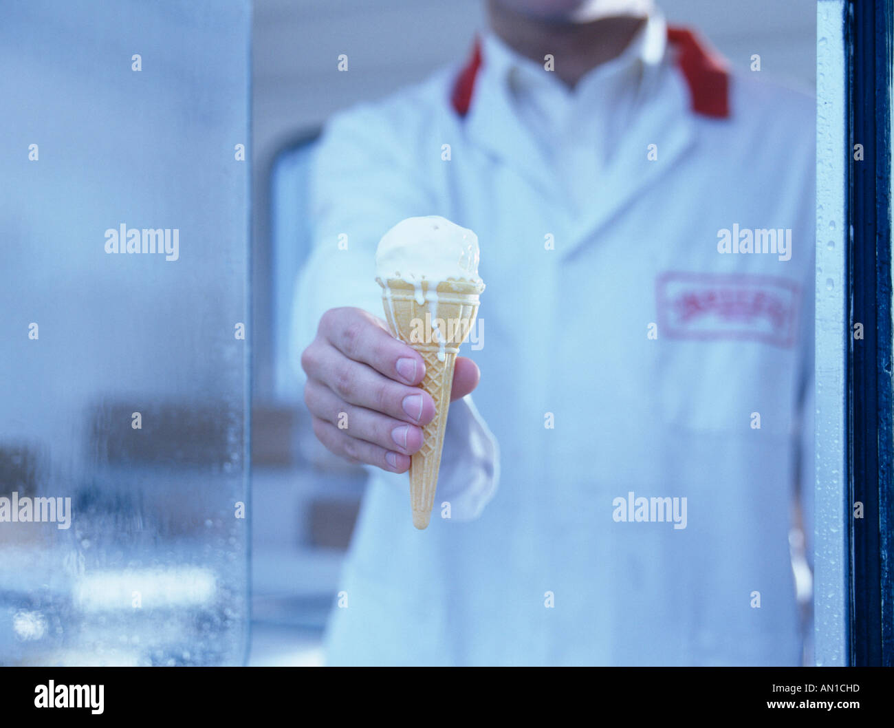Hand holding an ice cream Stock Photo - Alamy