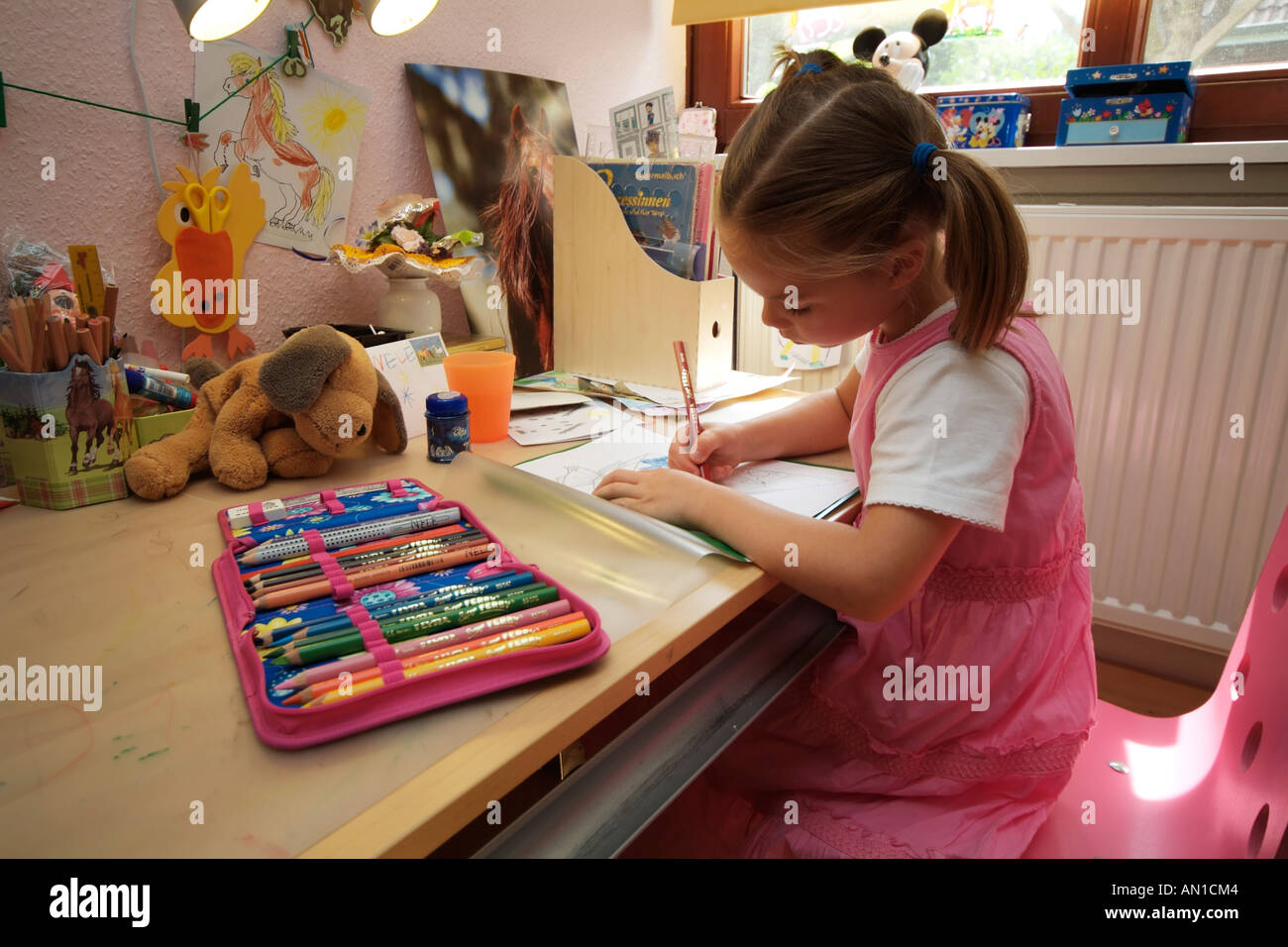 6-years old proud schoolgirl doing her first schoolworks ever Hamburg ...