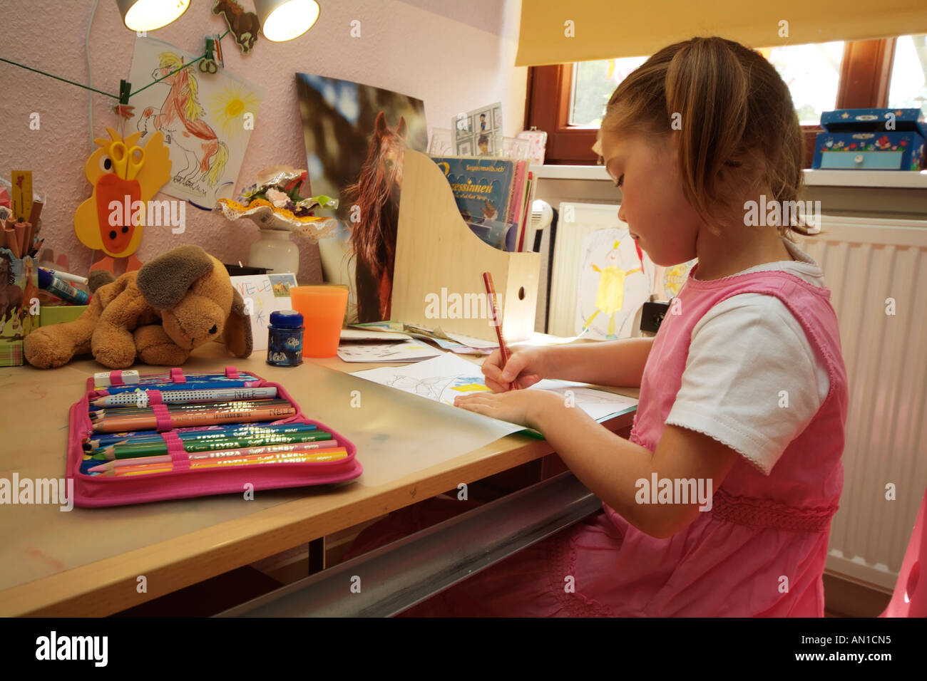 6-years old proud schoolgirl doing her first schoolworks ever Hamburg ...