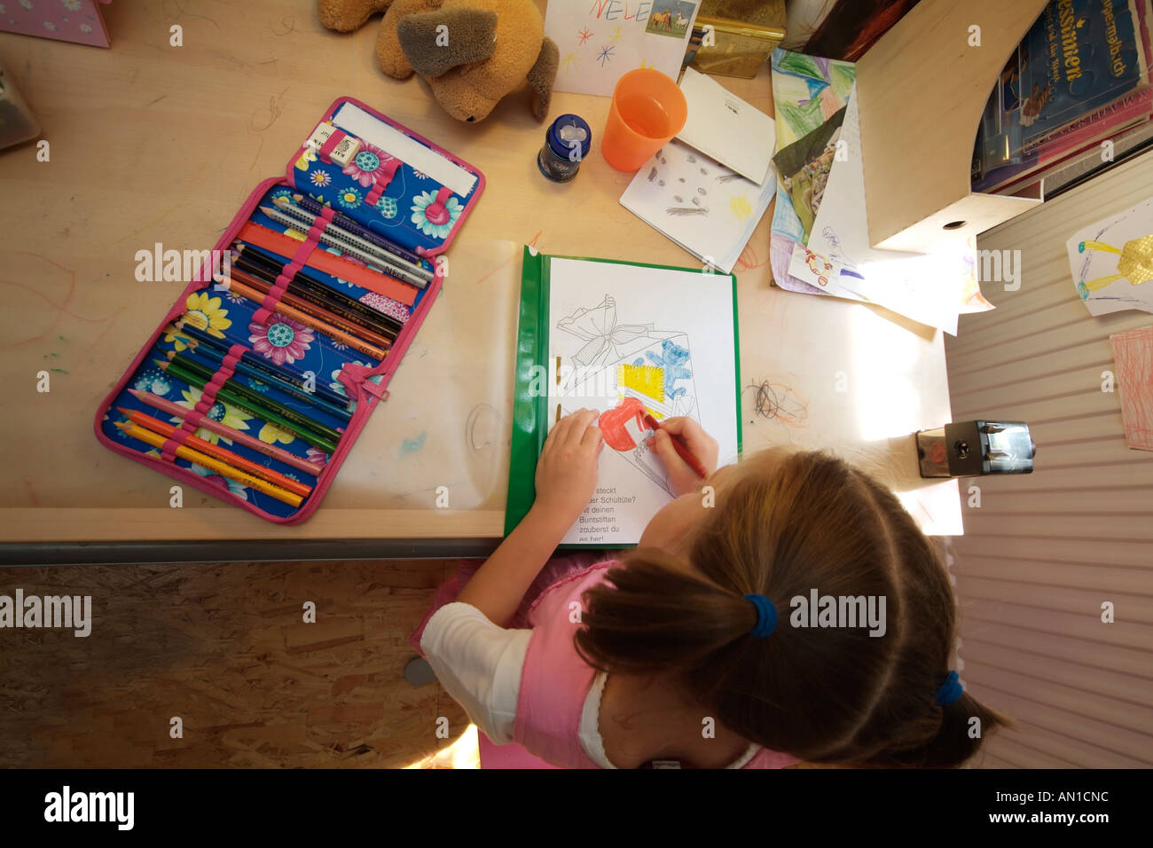 6-years old proud schoolgirl doing her first schoolworks ever Hamburg ...