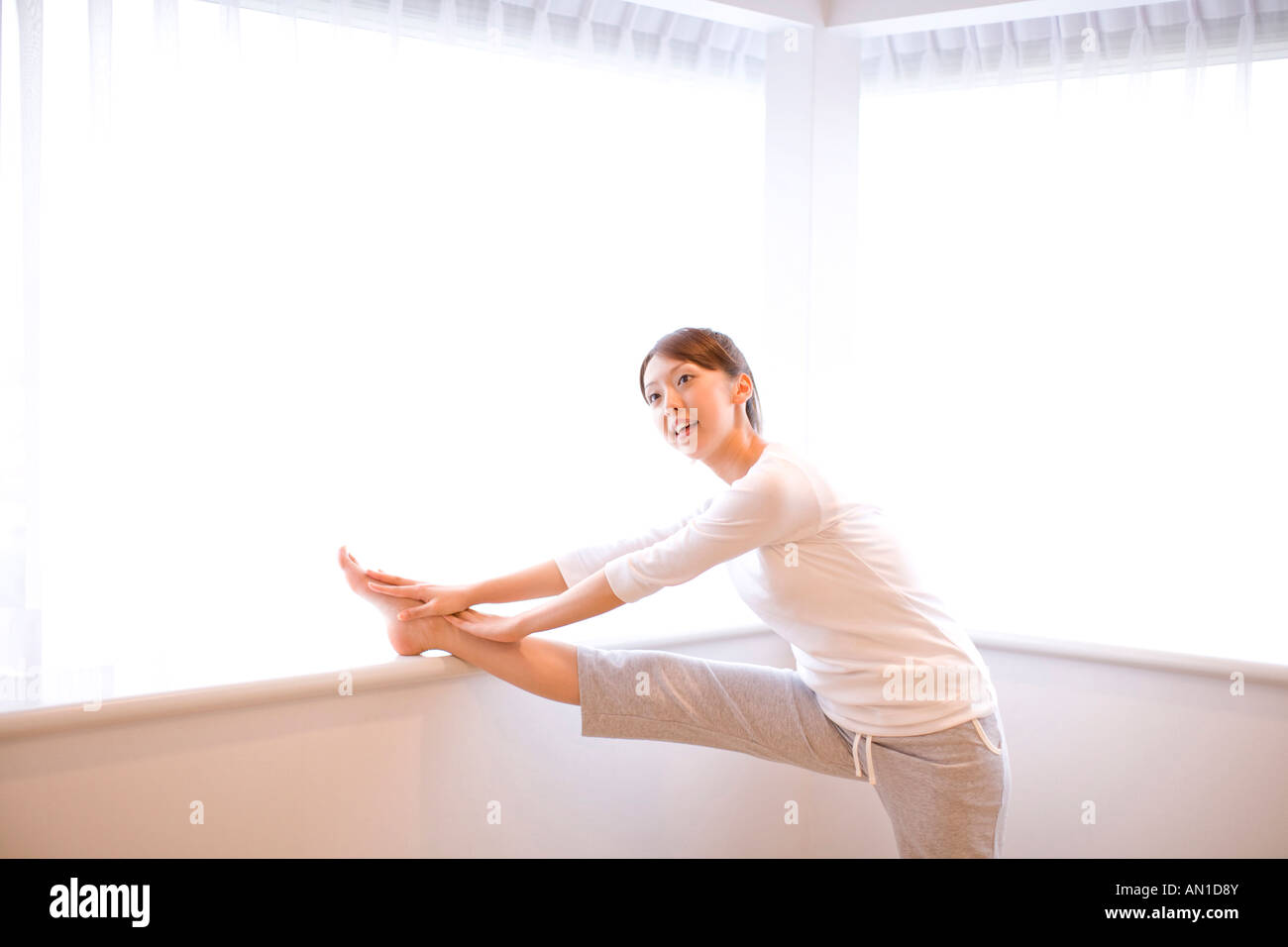 Japanese woman doing exercise Stock Photo - Alamy