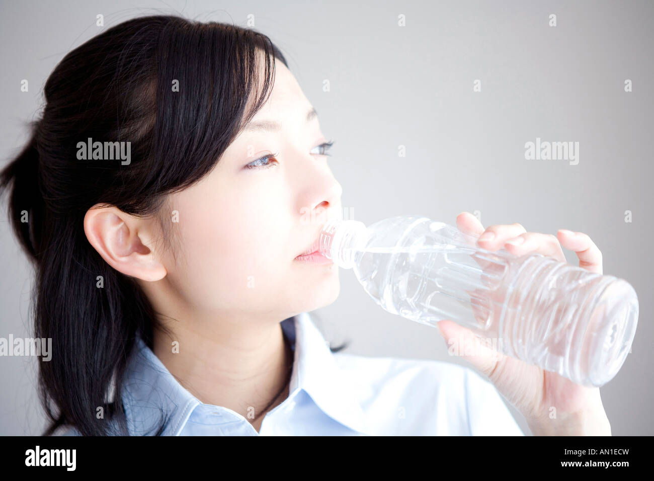 Japanese woman drinking a water Stock Photo - Alamy