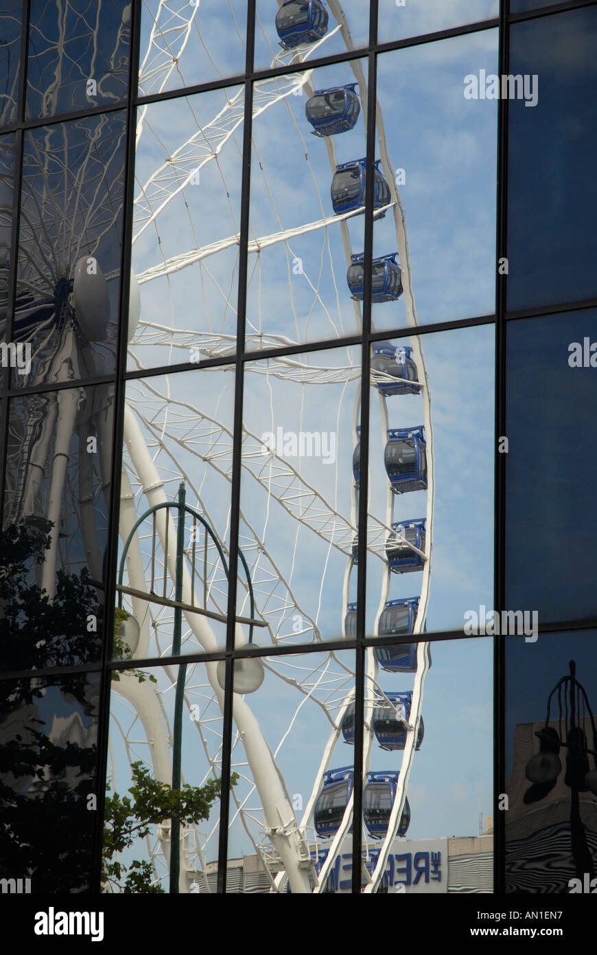 Big wheel reflection in glass panels Stock Photo - Alamy