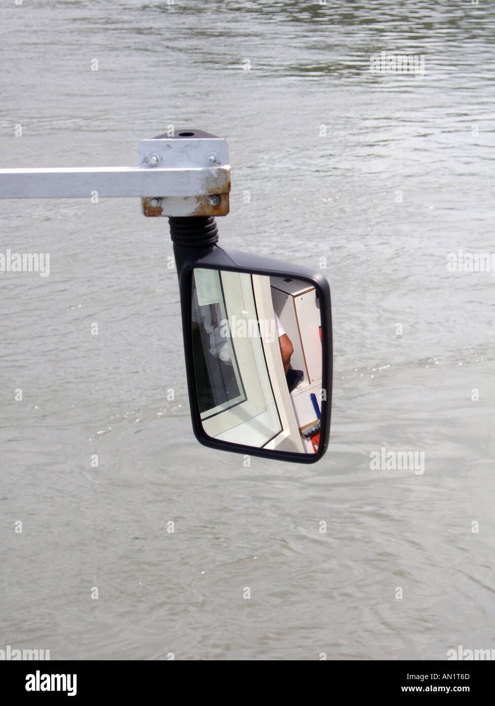 wing mirror showing captain on river boat Stock Photo - Alamy