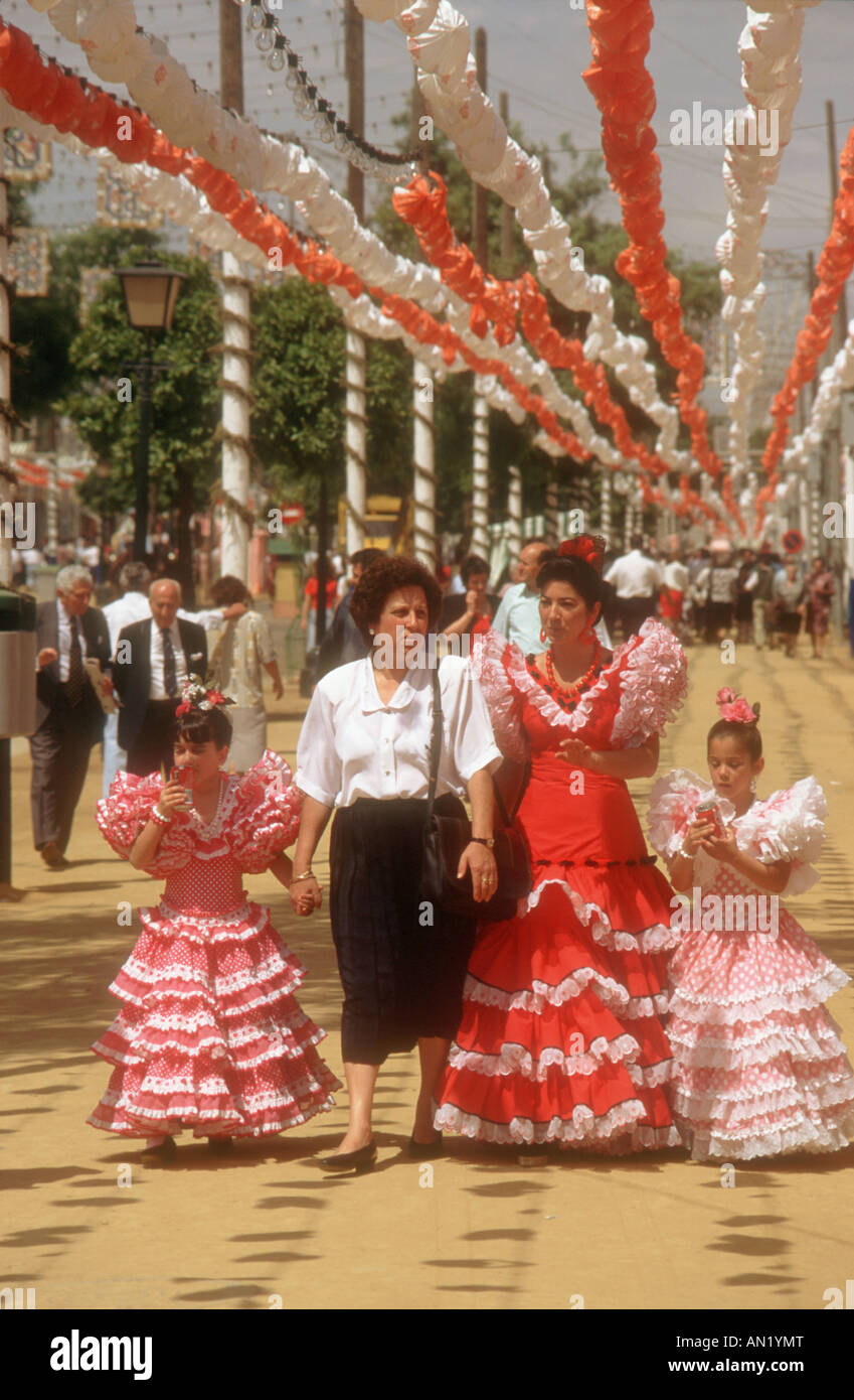 Spring Fair in Seville with women and young girls wearing Flamenco ...