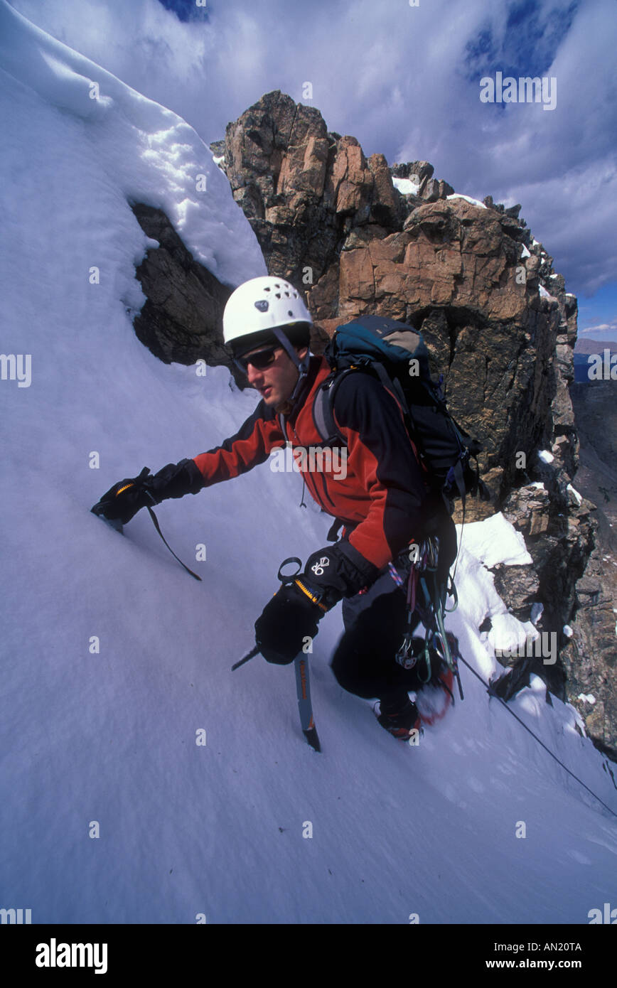 Alpine climber ascending a steep snow chute Stock Photo - Alamy