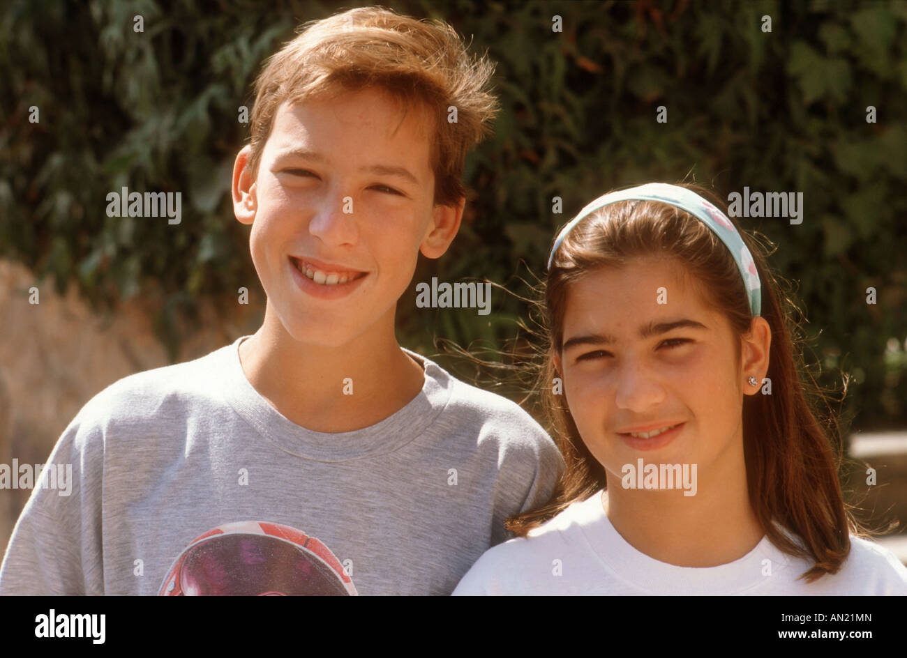 Portrait of teenage boy and girl smiling. Spain Stock Photo - Alamy