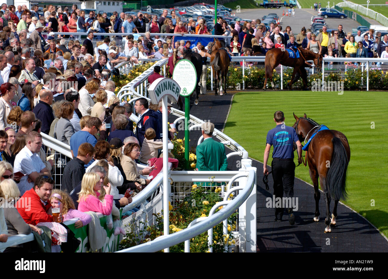 Parade ring with jockeys owners and trainers at Chepstow Racecourse ...