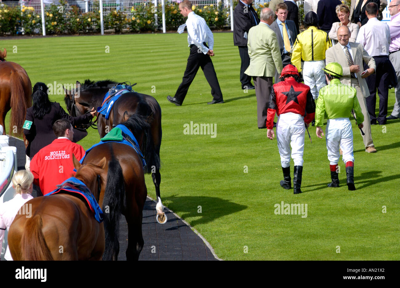 Parade ring with jockeys owners and trainers at Chepstow Racecourse ...