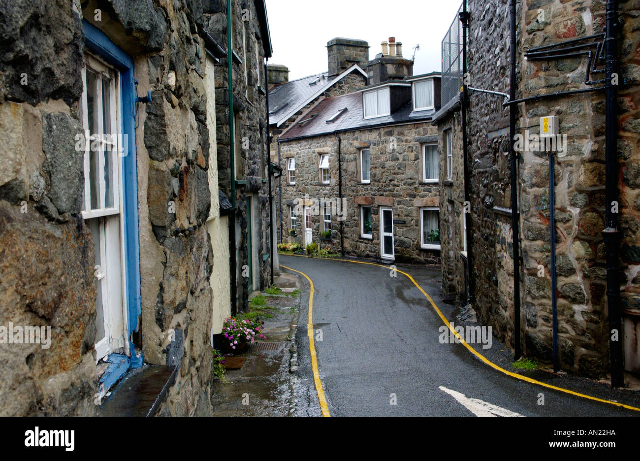 Narrow street of traditional grey stone built houses in Dolgellau ...