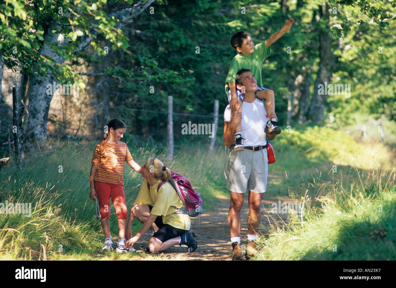 Family with two children walking on a path in the countryside Stock ...