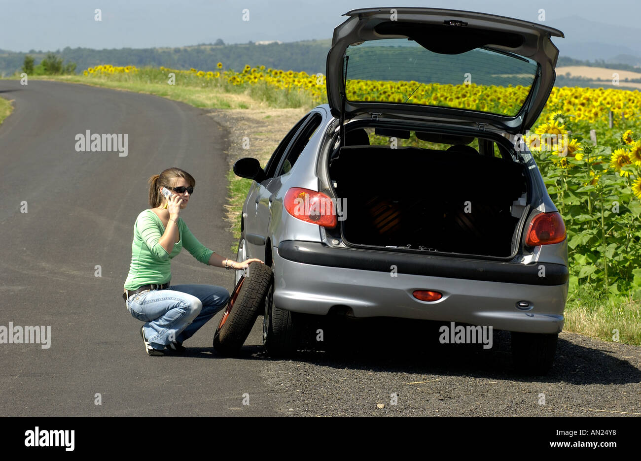 Woman flat tire in car hi-res stock photography and images - Alamy