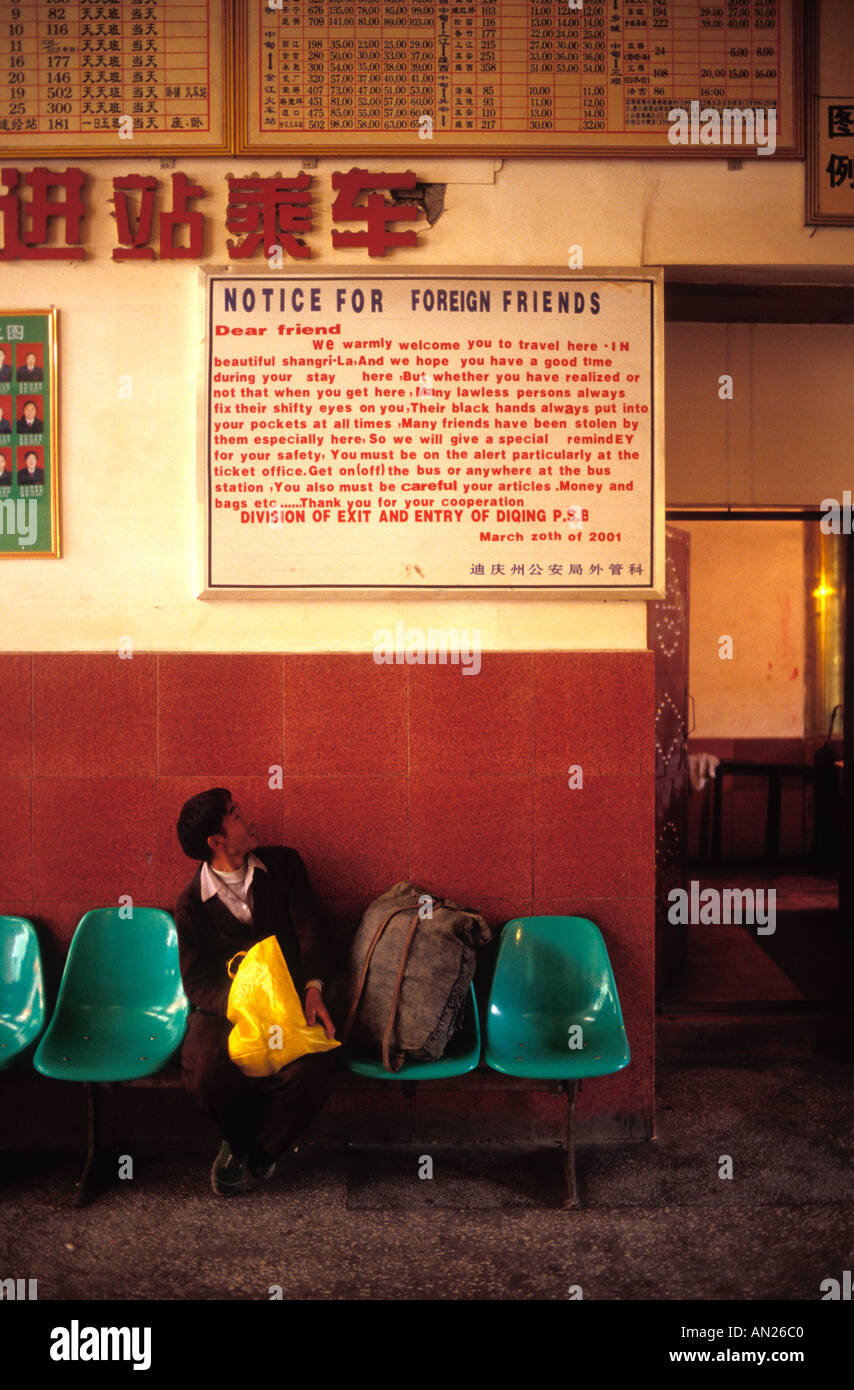 Chinese commuter reads English bus sign for foreigners Zhongdian County ...